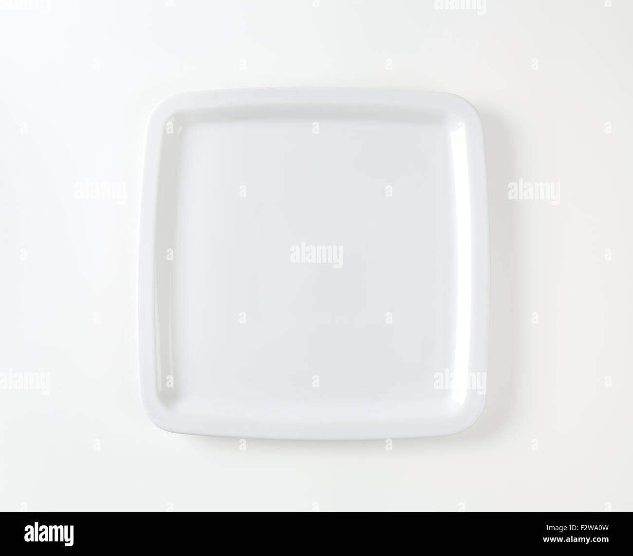empty white square plate on white background Stock Photo - Alamy