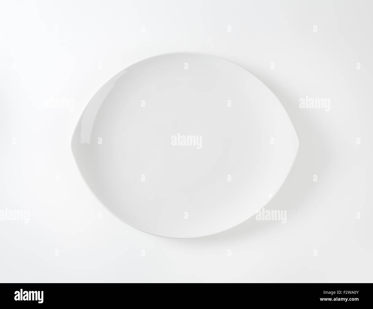 empty white plate on white background Stock Photo - Alamy