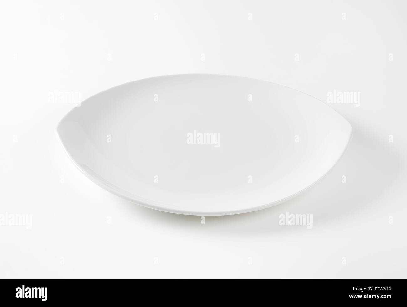 empty white plate on white background Stock Photo - Alamy