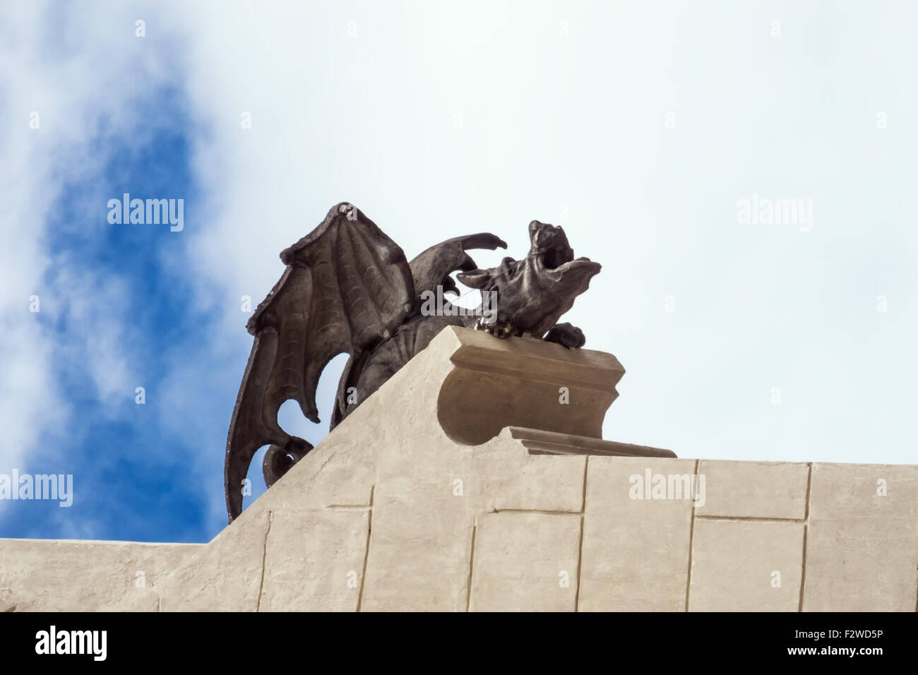 Demonic gargoyle reaching for the sky Stock Photo - Alamy