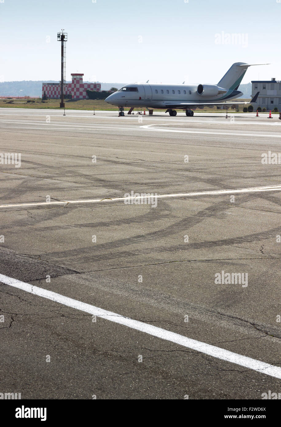 parked private airplane on the runway. white, modern, business class ...