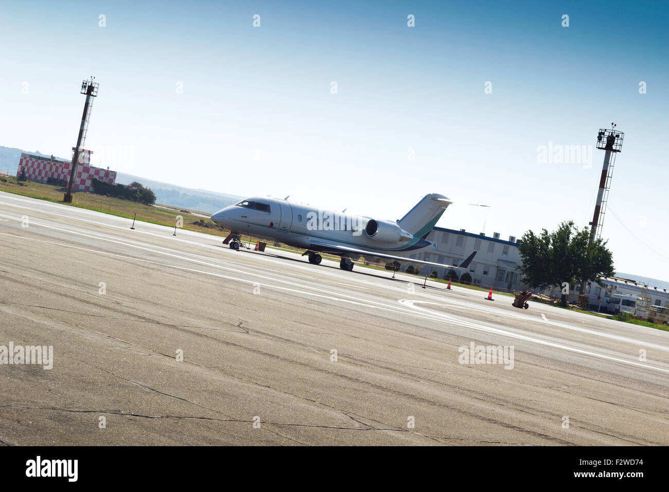 parked private airplane on the runway. white, modern, business class ...