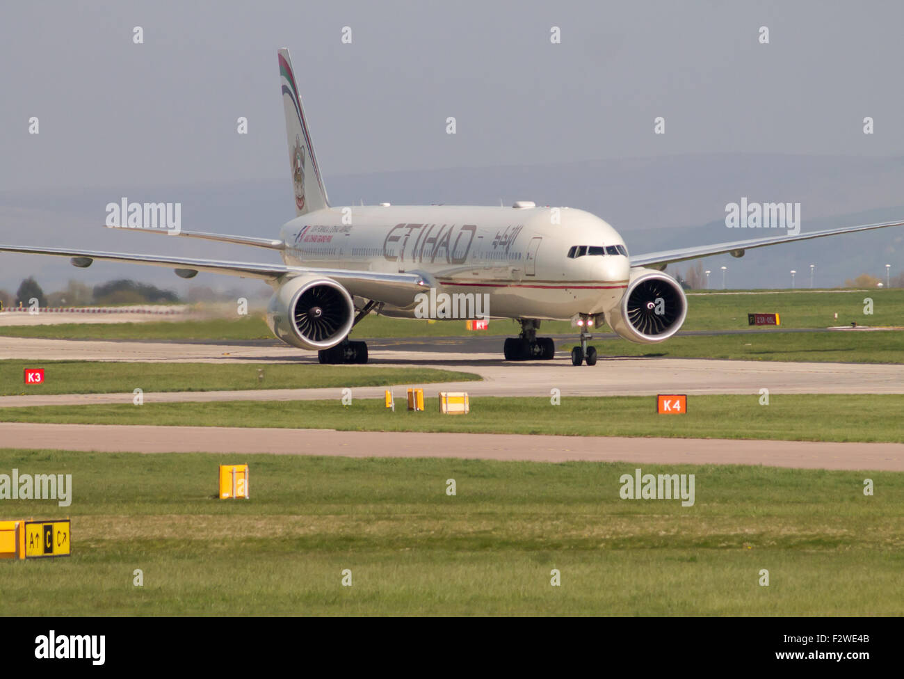 Etihad Airways Boeing 777-300 taxiing at Manchester International ...