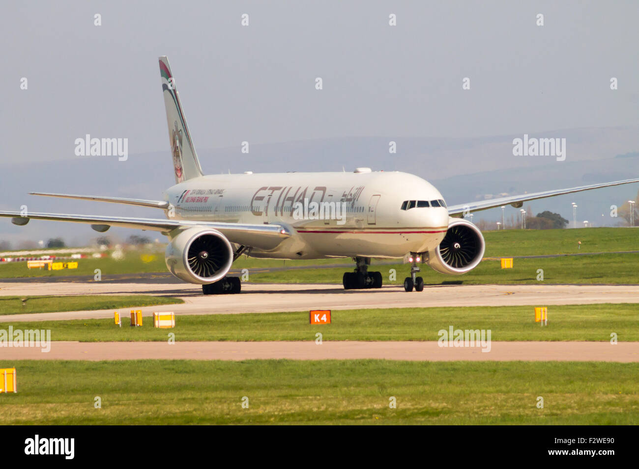 Etihad Airways Boeing 777-300 taxiing at Manchester International ...
