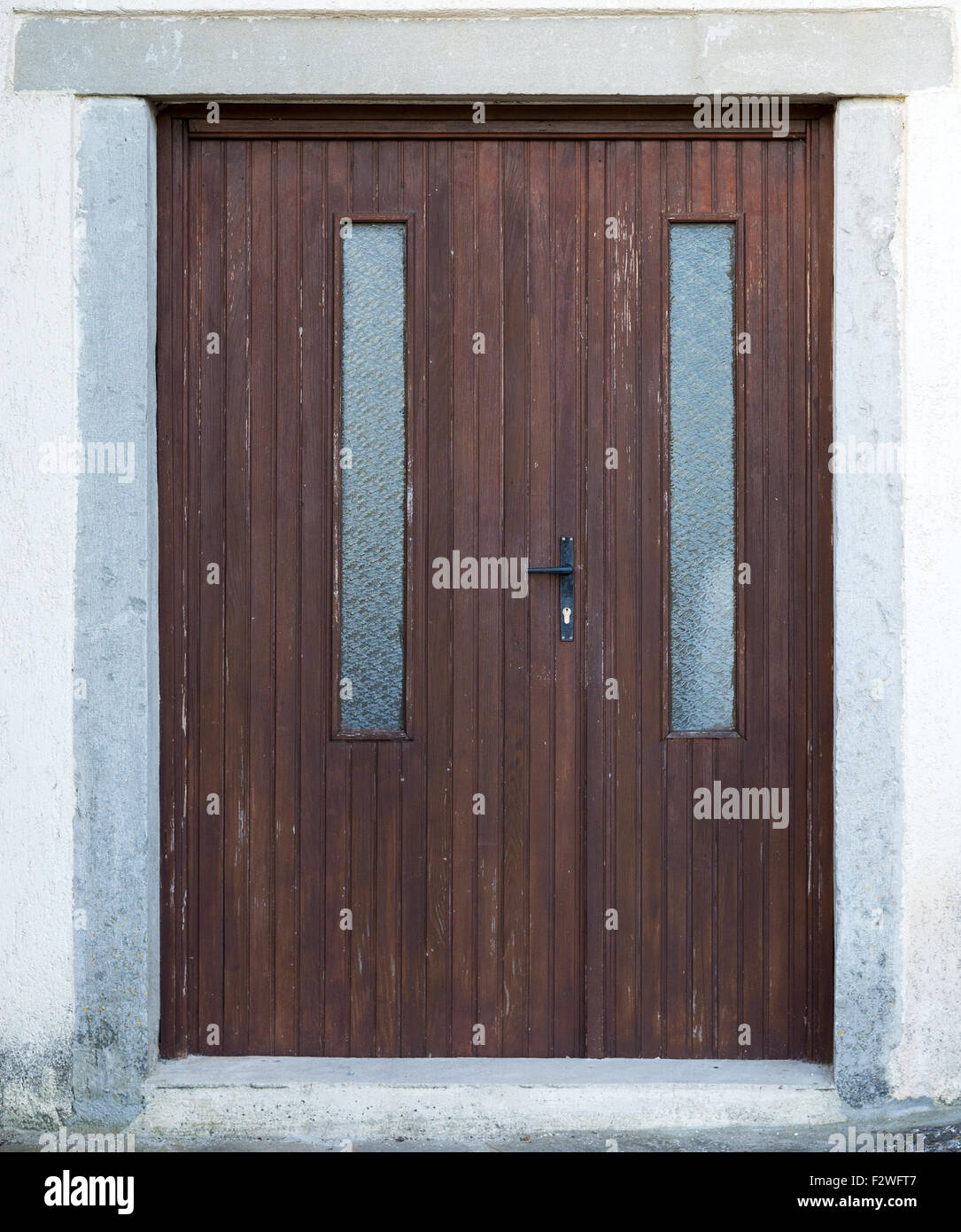 an old brown ragged shabby wooden door Stock Photo - Alamy