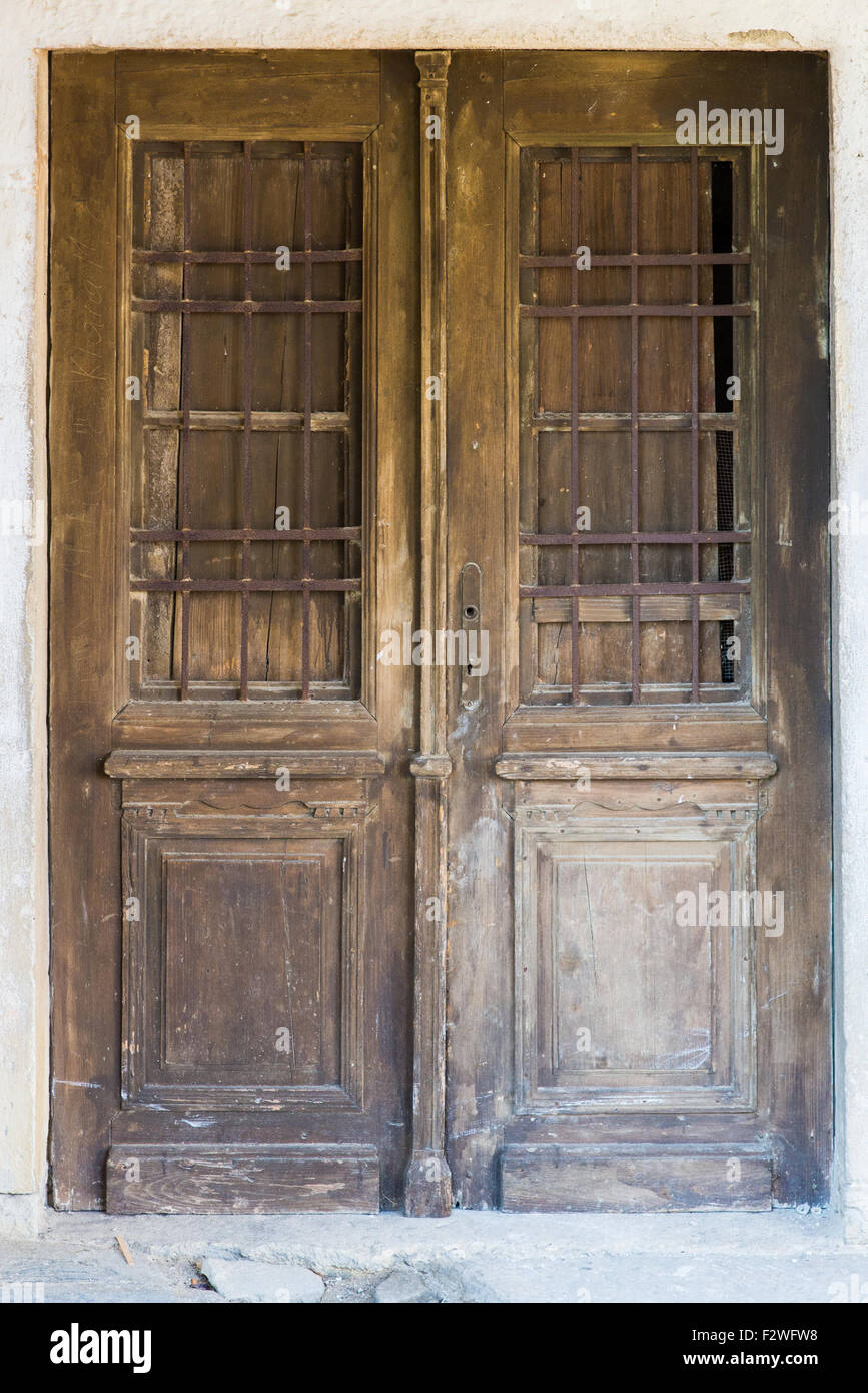 an old brown ragged shabby wooden door Stock Photo - Alamy