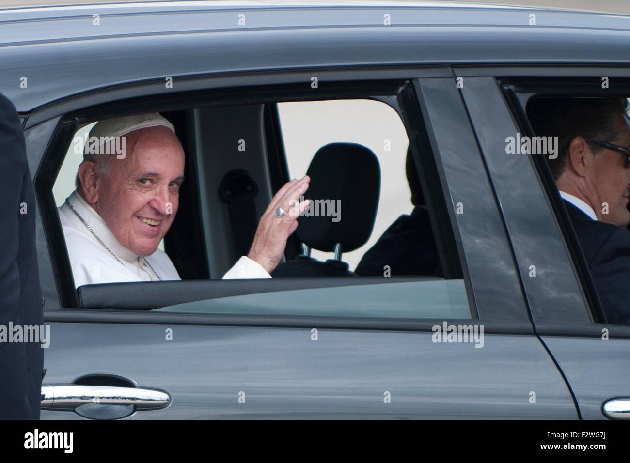 Pope Francis waves from the motorcade after arriving at Joint Base ...