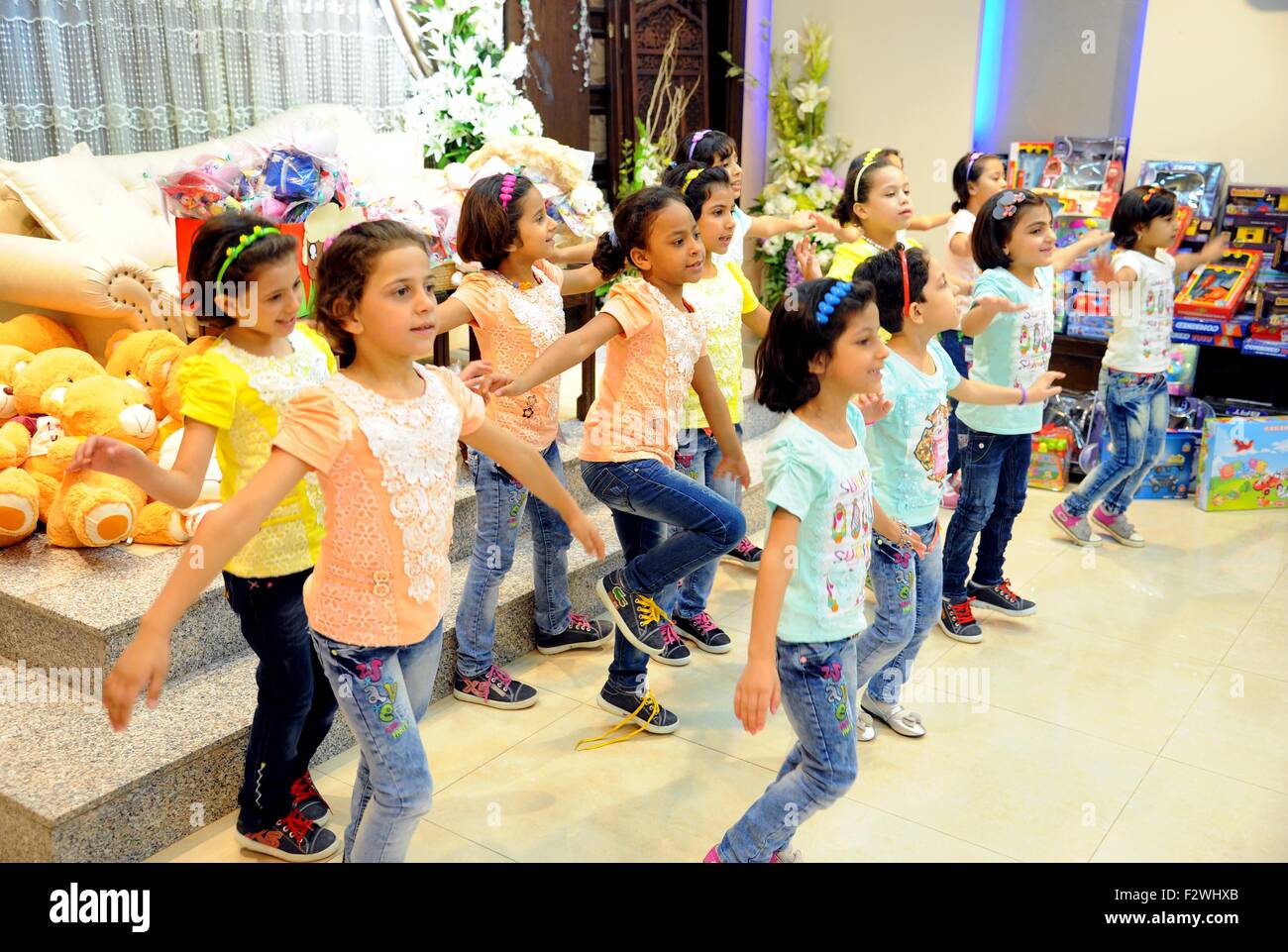 Damascus, Syria. 24th Sep, 2015. Syrian orphans dance on a party ...