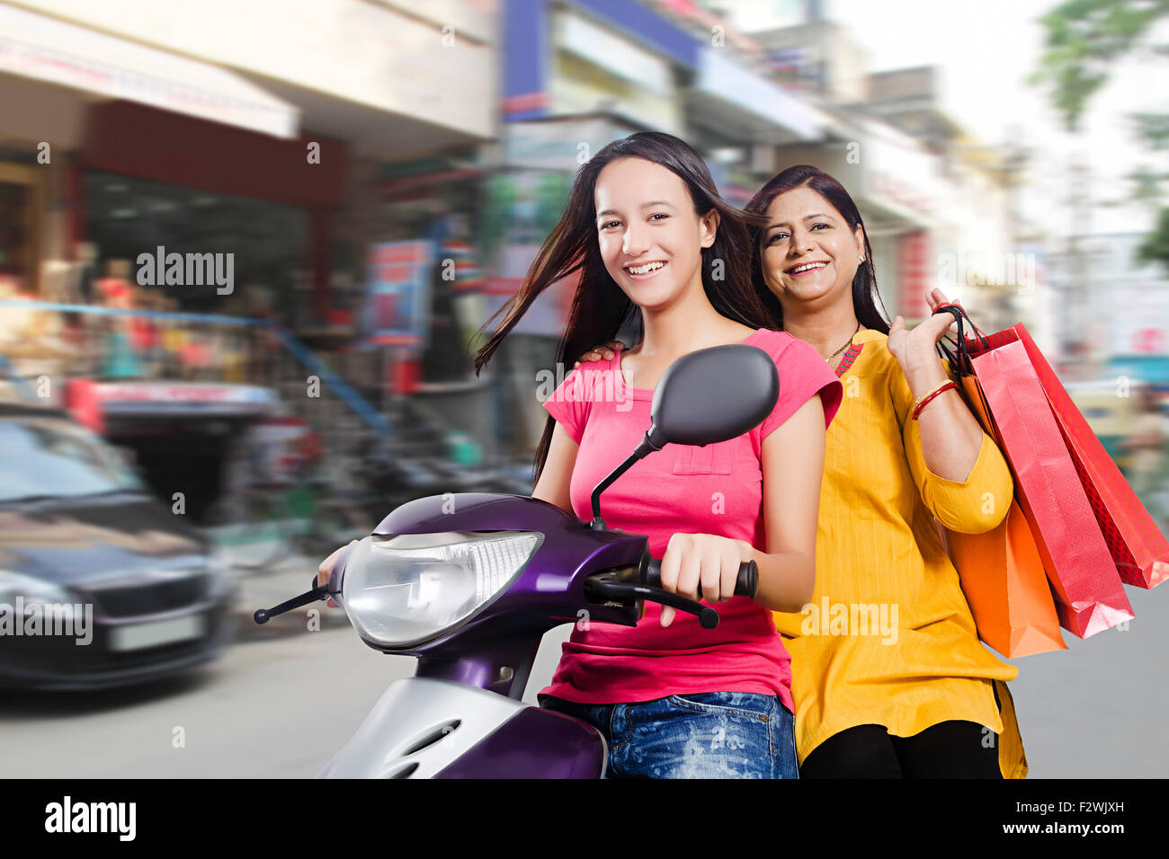 Girl riding scooty hi-res stock photography and images - Alamy