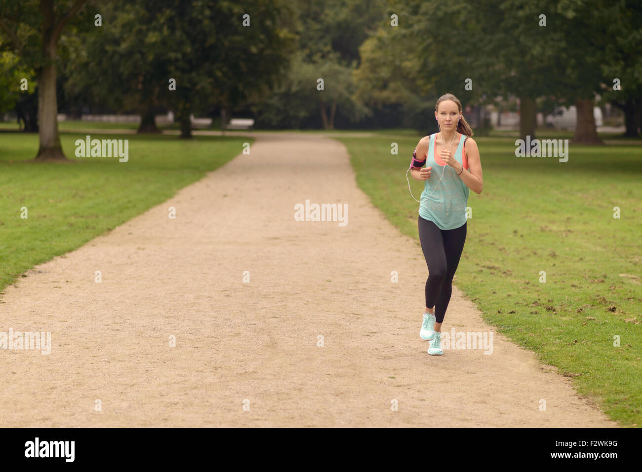 Full Body Shot of an Athletic Woman Doing a Running Exercise at the ...