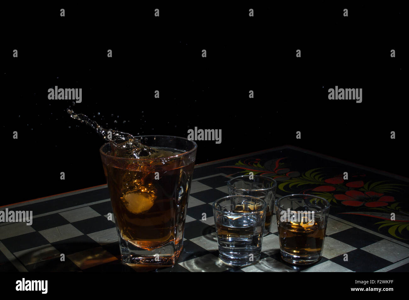 Russian Alcohol checkers with splashes of whiskey. Low-Key Stock Photo ...