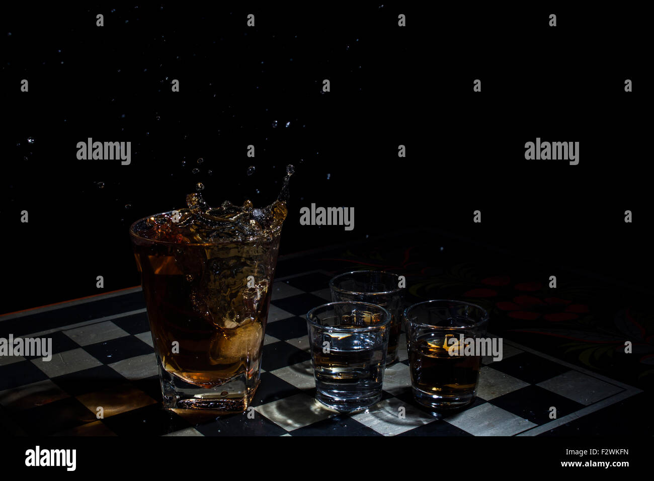 Russian Alcohol checkers with splashes of whiskey. Low-Key Stock Photo ...