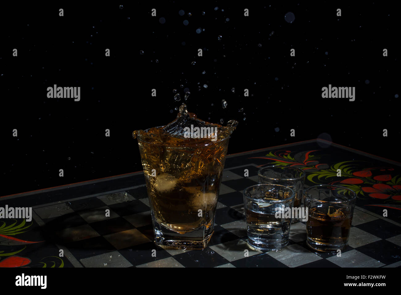 Russian Alcohol checkers with splashes of whiskey. Low-Key Stock Photo ...