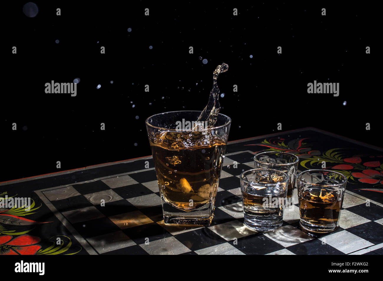 Russian Alcohol checkers with splashes of whiskey. Low-Key Stock Photo ...