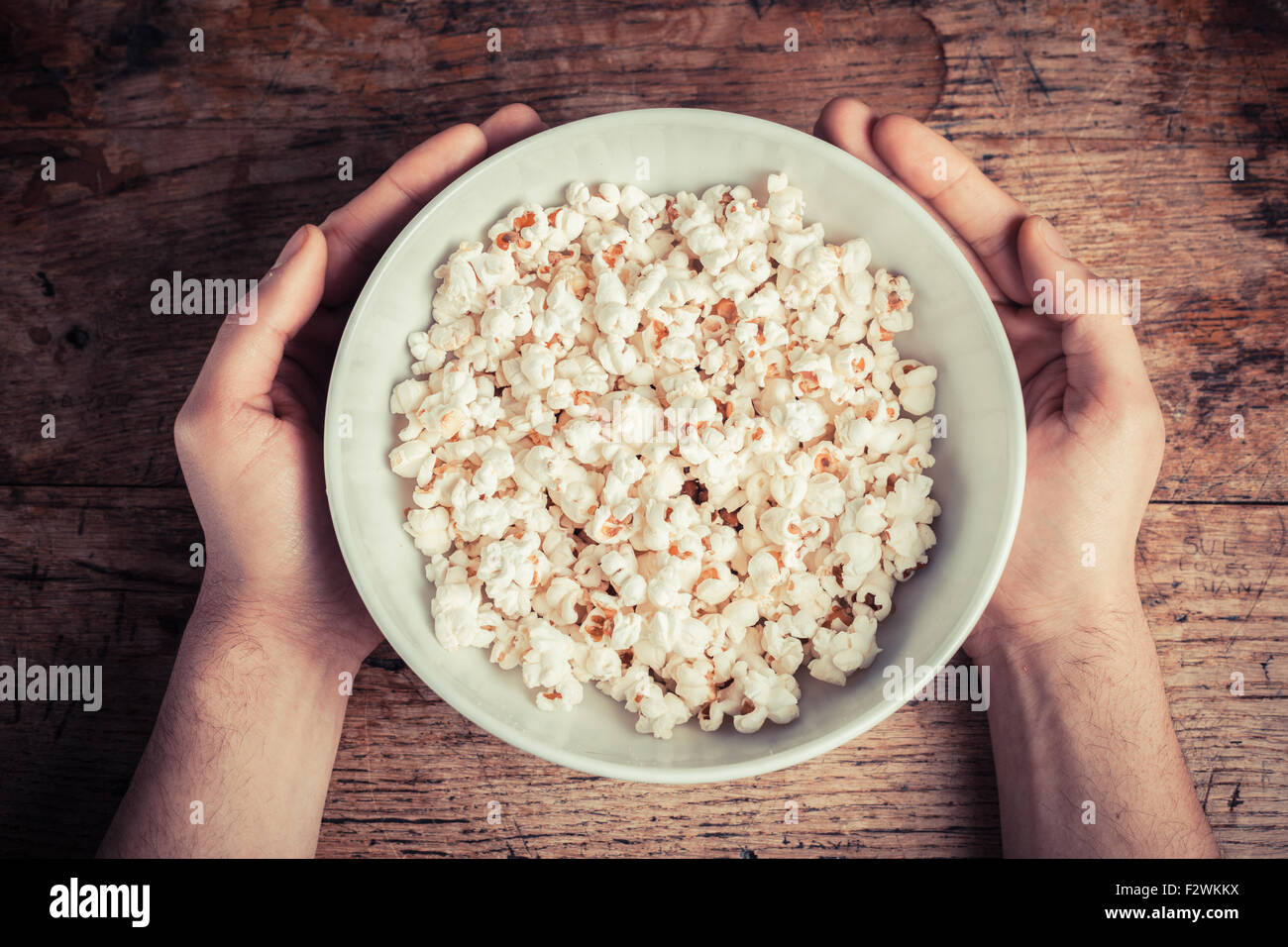 Popcorn cinema hands hi-res stock photography and images - Alamy