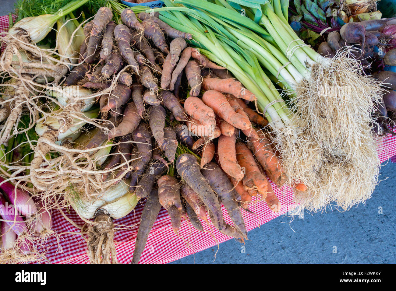 Display of leek and rare heirloom carrots at the local food market ...