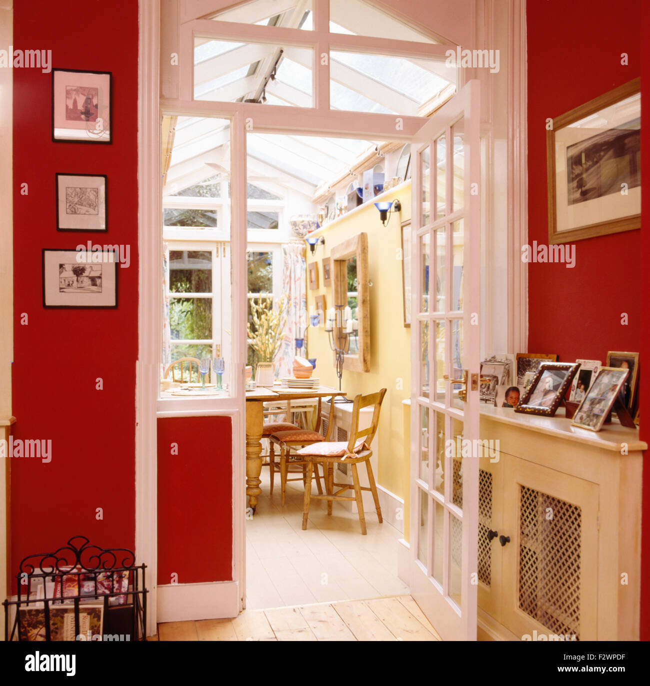 Door open to nineties conservatory dining room Stock Photo - Alamy