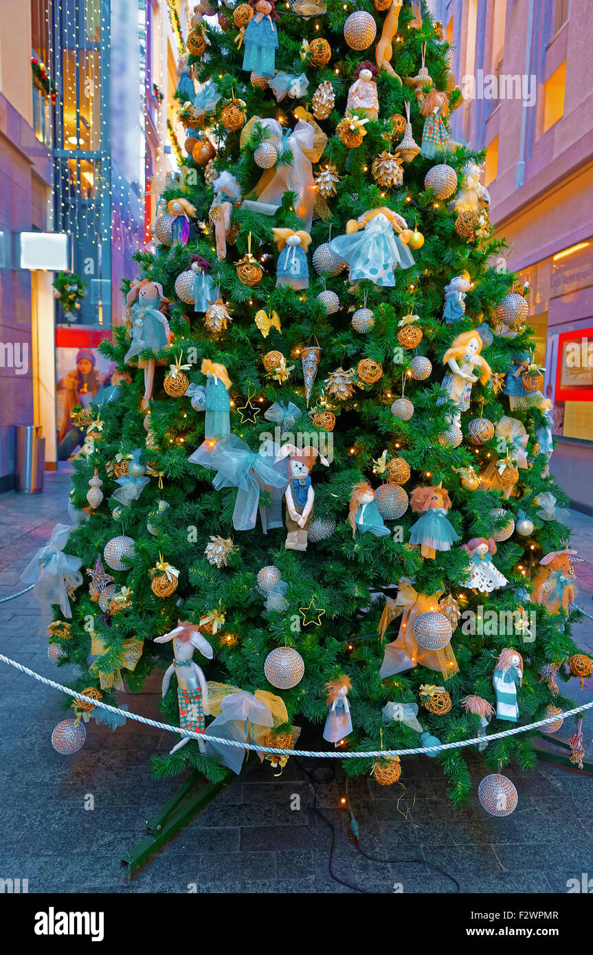 Traditional Christmas fir tree with gold and blue color decorations in ...