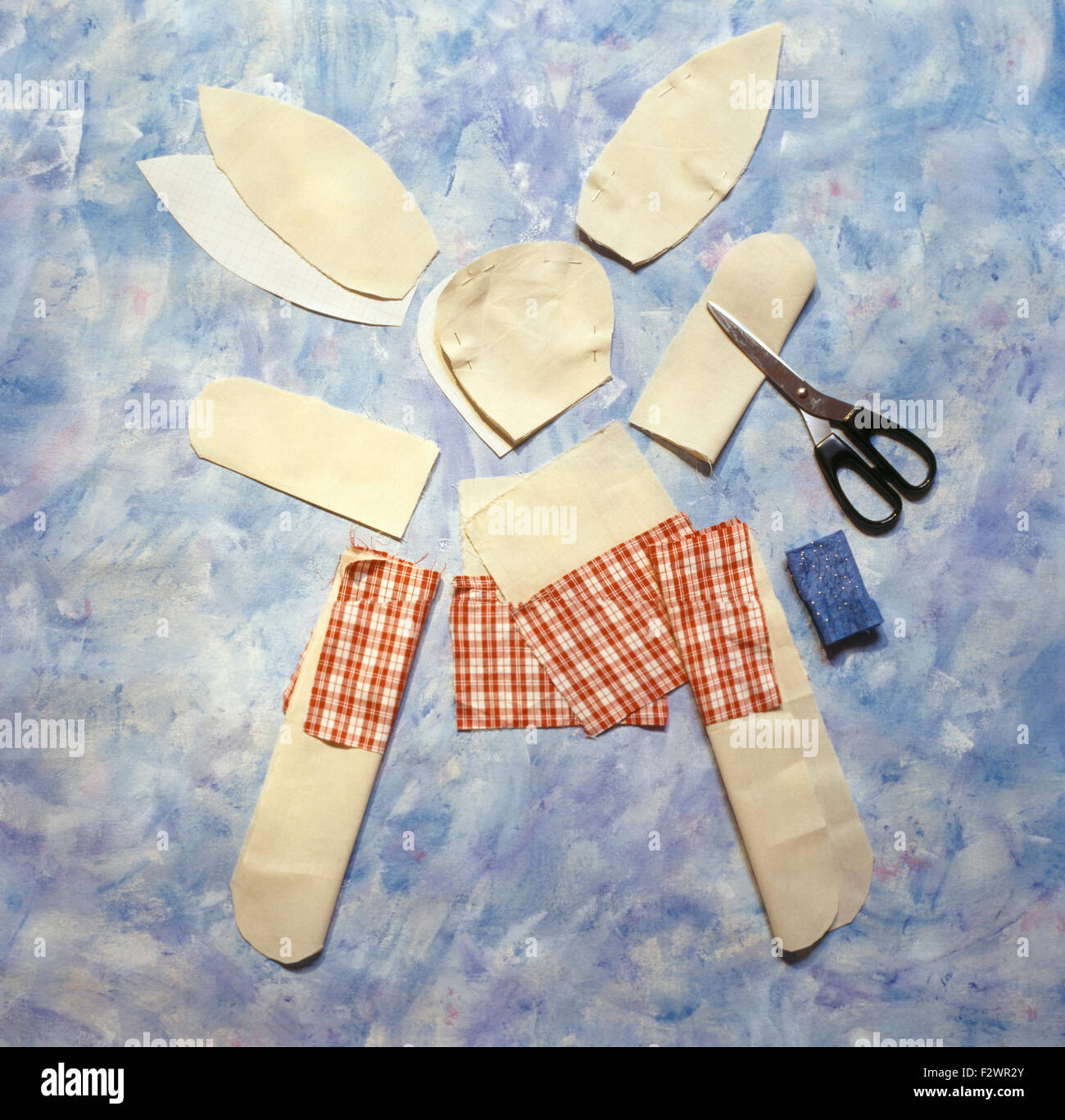Materials and tools for making a rabbit rag doll Stock Photo - Alamy