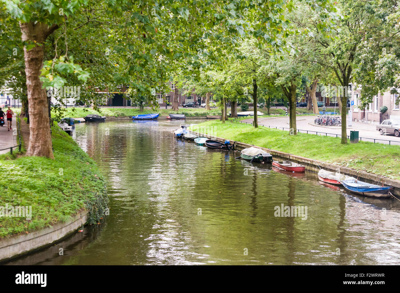 Boats moored alongside the main canal in the Dutch city of Utrecht ...