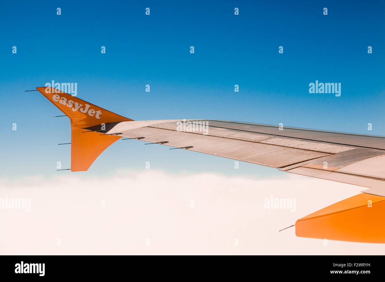 Wing of an easyJet plane in flight Stock Photo - Alamy