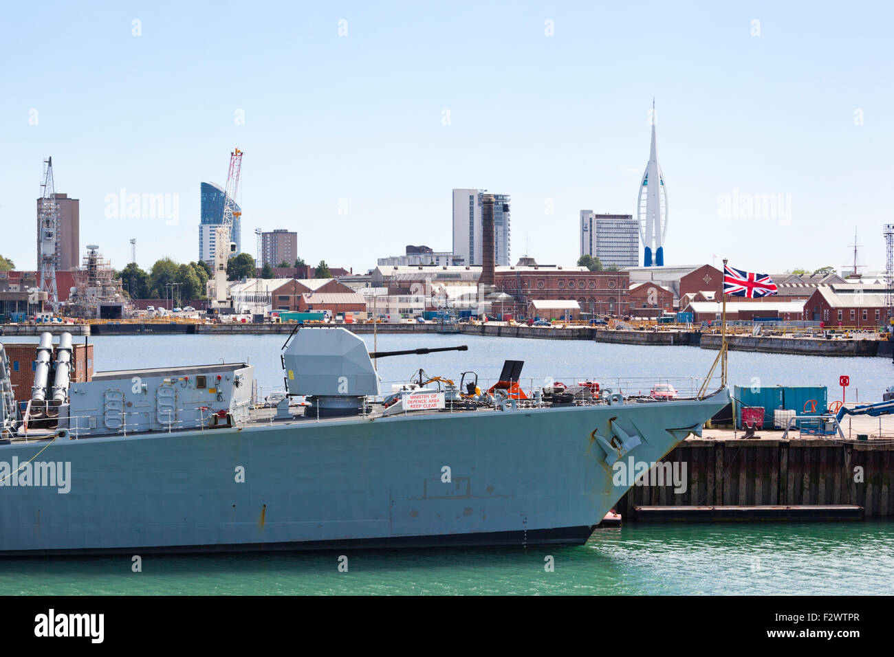 The Portsmouth skyline seen across the bows of HMS Iron Duke (F234) a ...