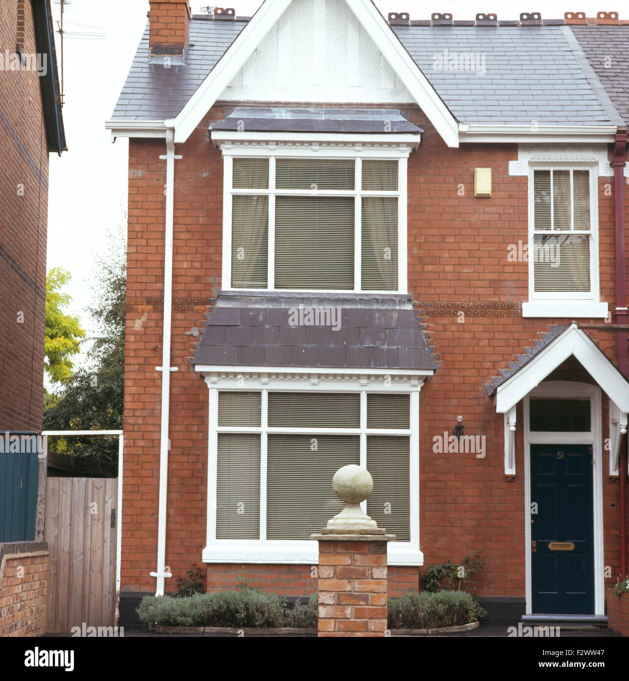 Exterior of Victorian terraced house with new windows Stock Photo - Alamy
