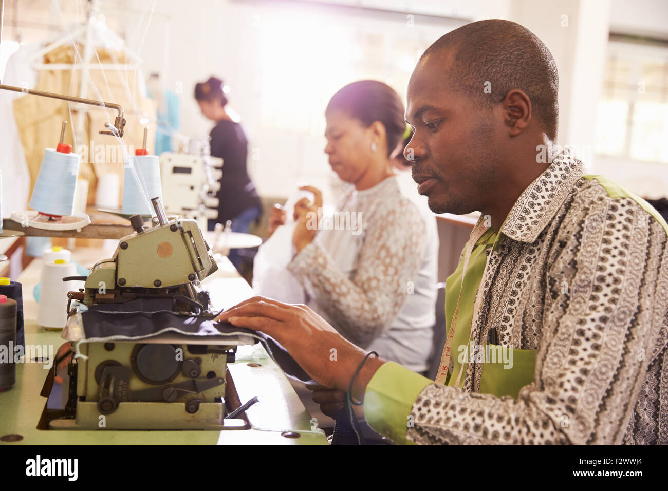 People sewing at a community project workshop, South Africa Stock Photo ...