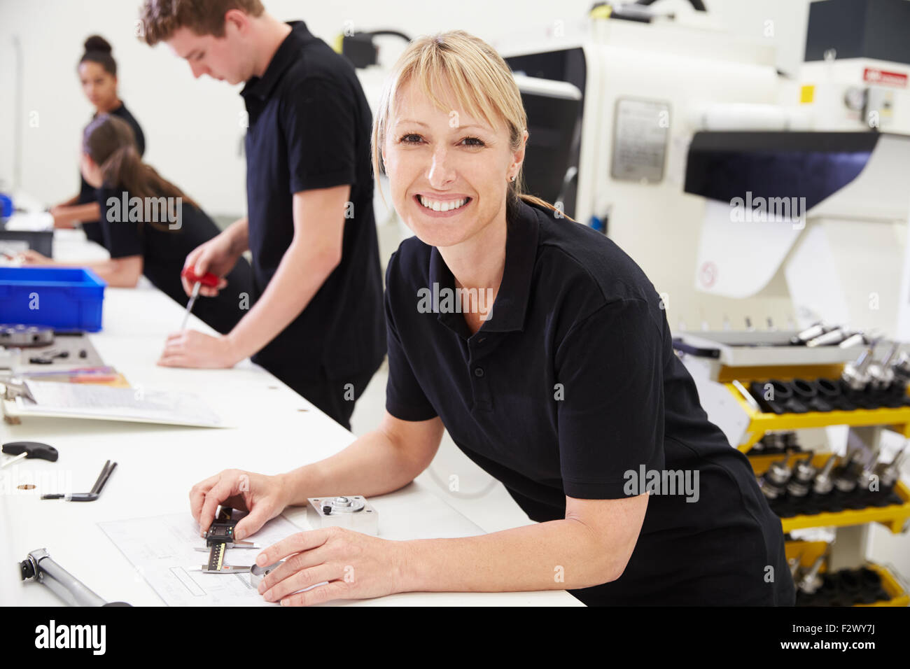 Workers In Engineering Factory Checking Component Quality Stock Photo ...