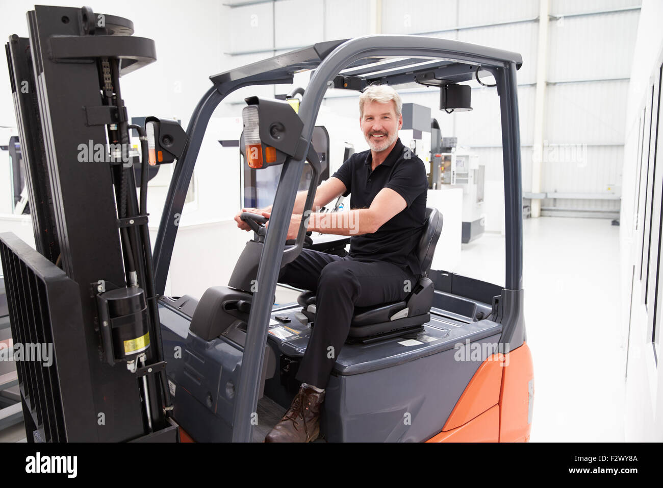 Portrait Of Male Fork Lift Truck Driver In Factory Stock Photo - Alamy