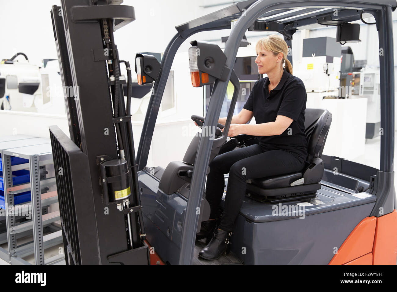 Woman driving fork lift truck hi-res stock photography and images - Alamy