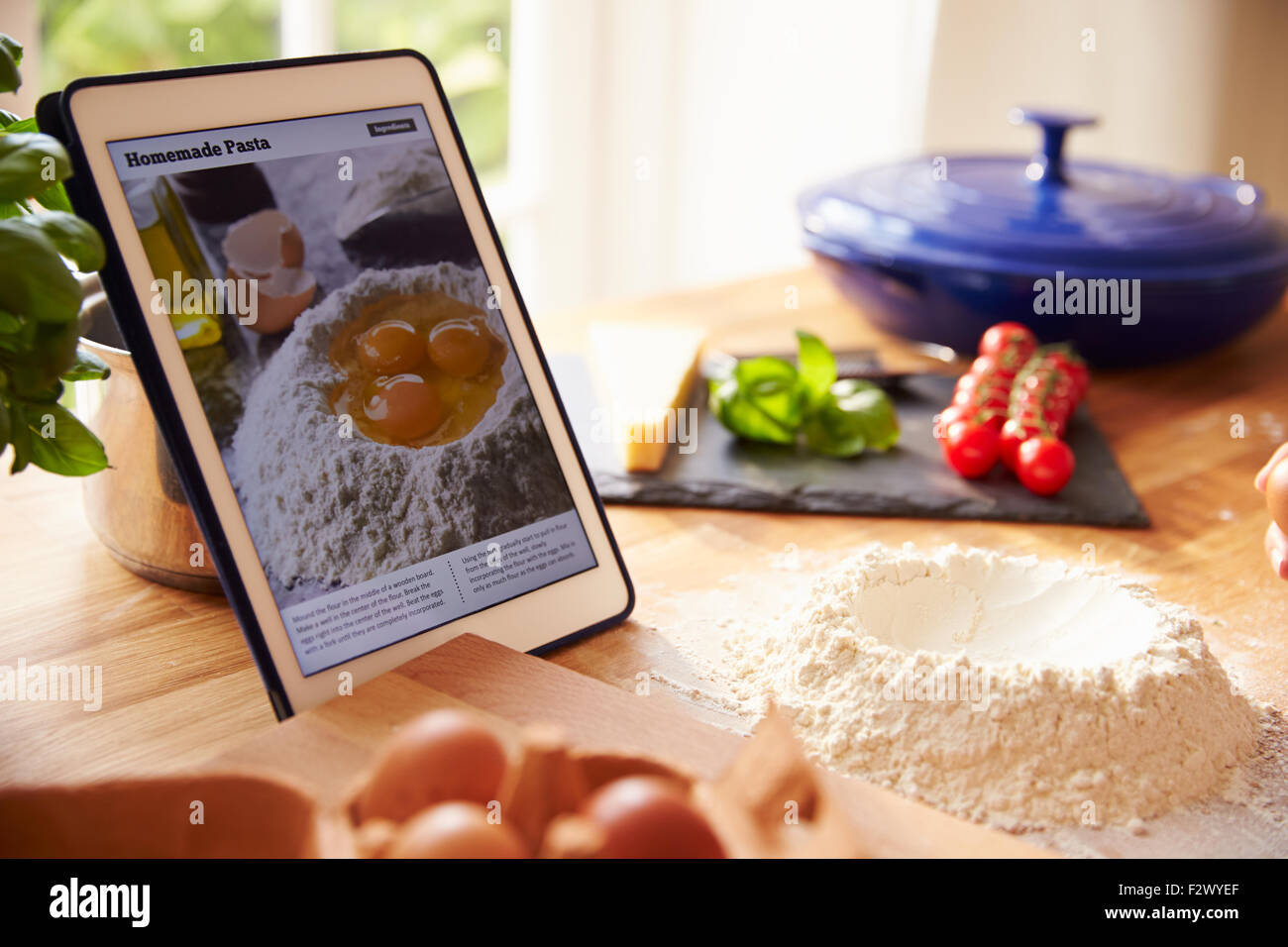 Following Pasta Recipe Using App On Digital Tablet Stock Photo - Alamy