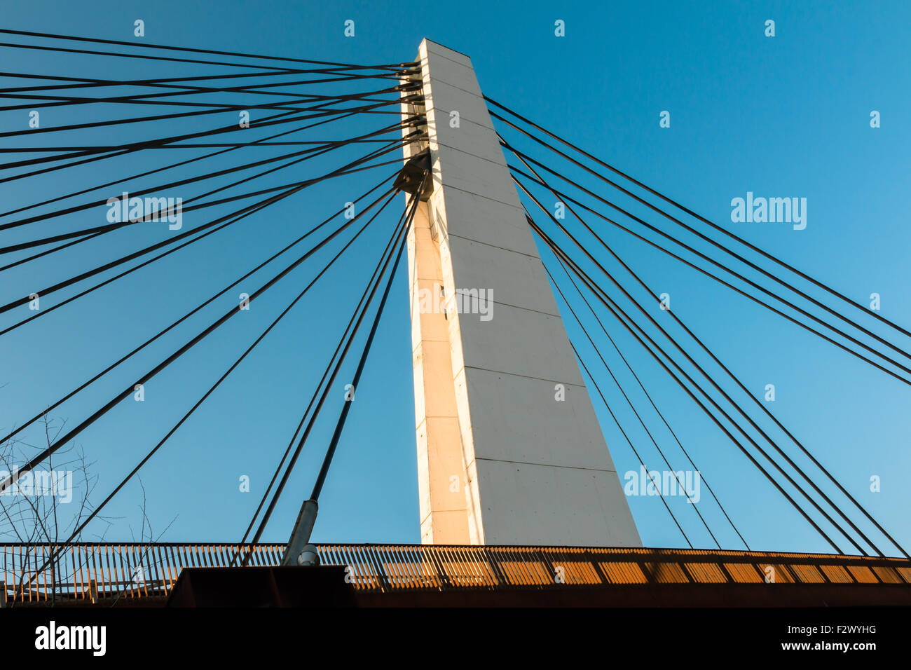 White steel cable bridge in modern architecture style against blue sky ...