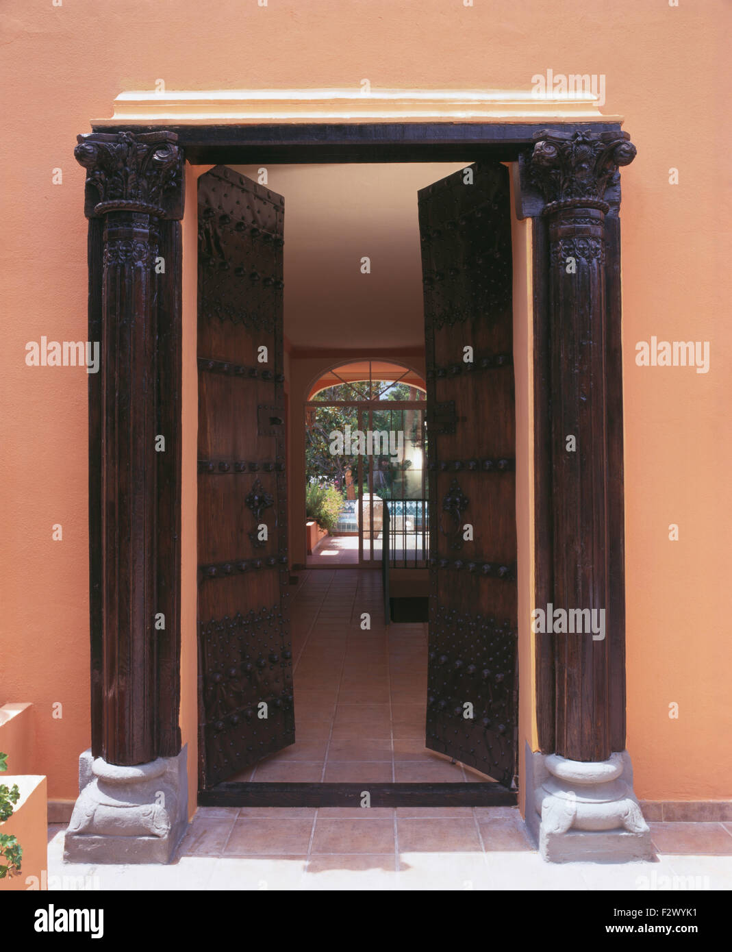 Marble pillars on either side of doorway of Spanish villa with view of ...