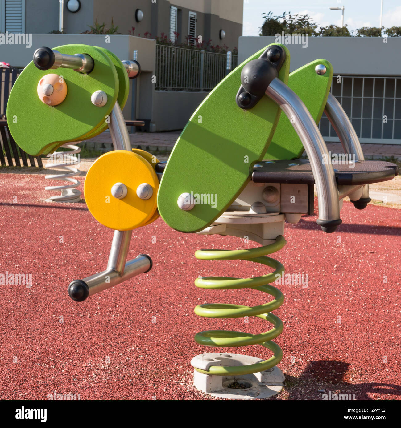 Bouncy colorful spring playground equipment in public park, plastic ...