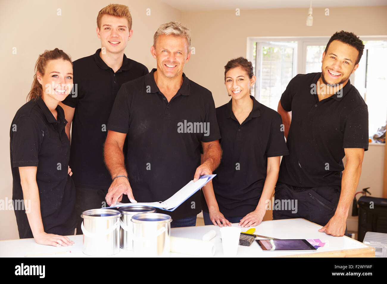 Interior decorating team portrait Stock Photo - Alamy