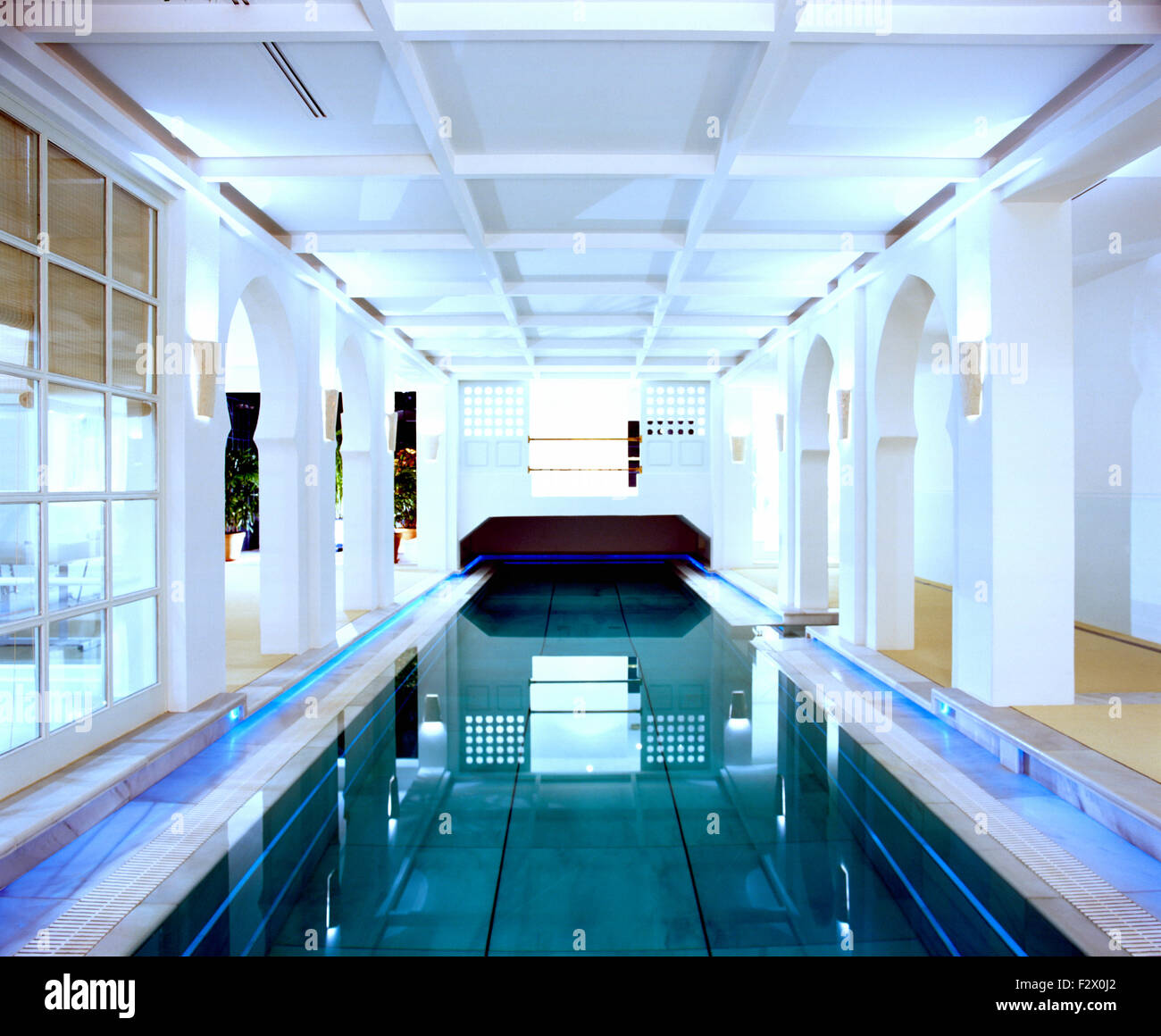 Interiors of a modern indoor pool in a Spanish villa Stock Photo - Alamy