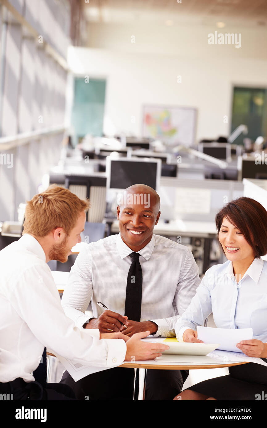 Three office colleagues in a casual team meeting Stock Photo - Alamy