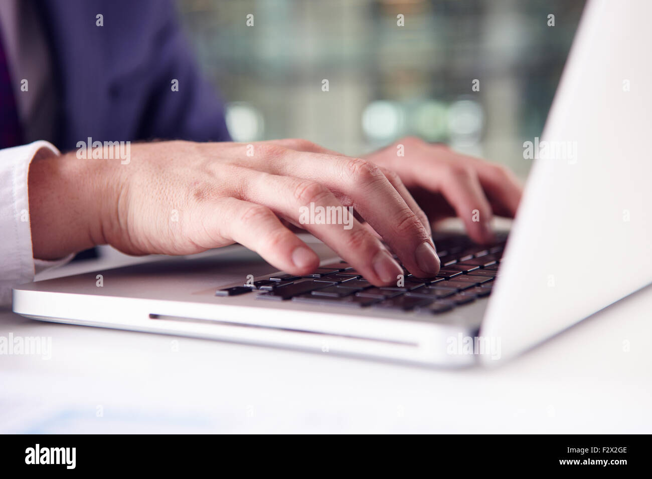 Close up of businessman?s hands using the keypad of a laptop Stock ...