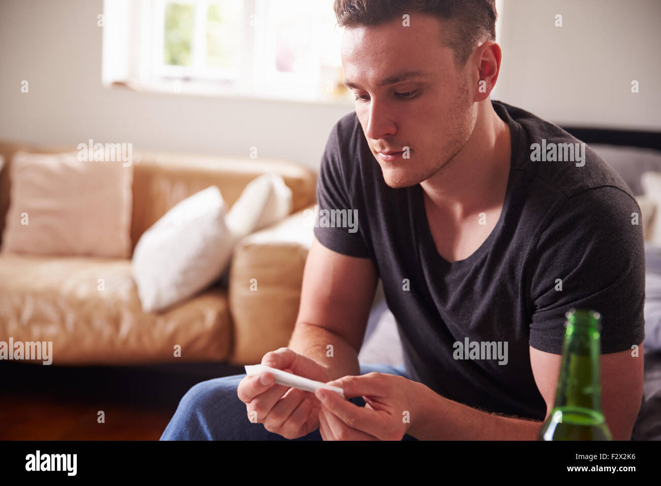 Young Man Smoking Marijuana At Home Stock Photo - Alamy