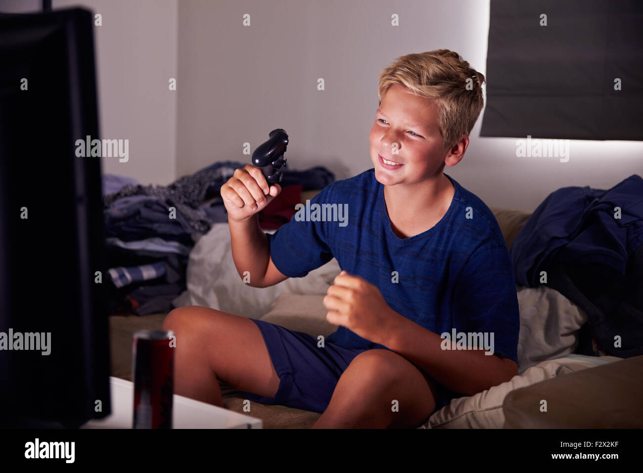 Teenage Boy Addicted To Video Gaming At Home Stock Photo - Alamy