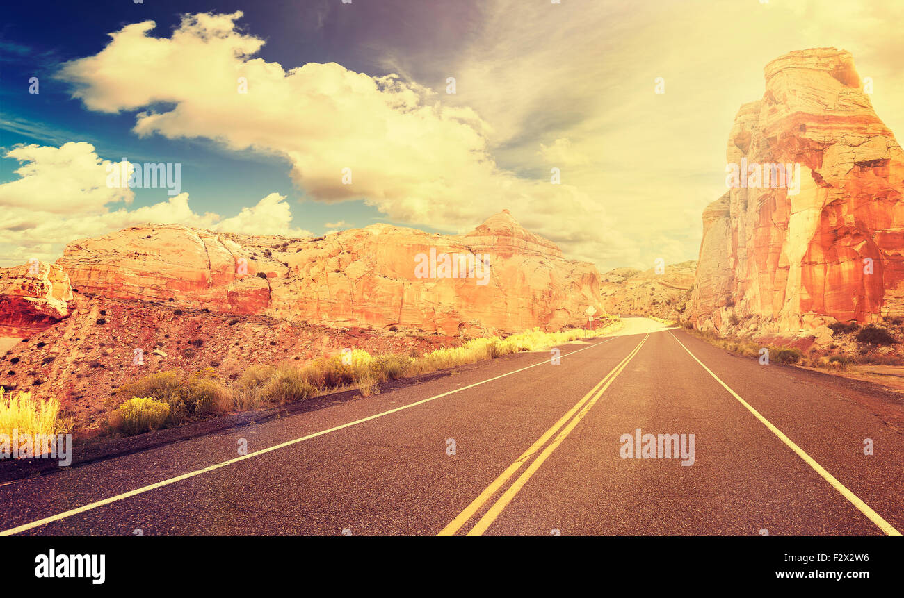 Retro vintage style mountain road at sunset, travel adventure concept ...