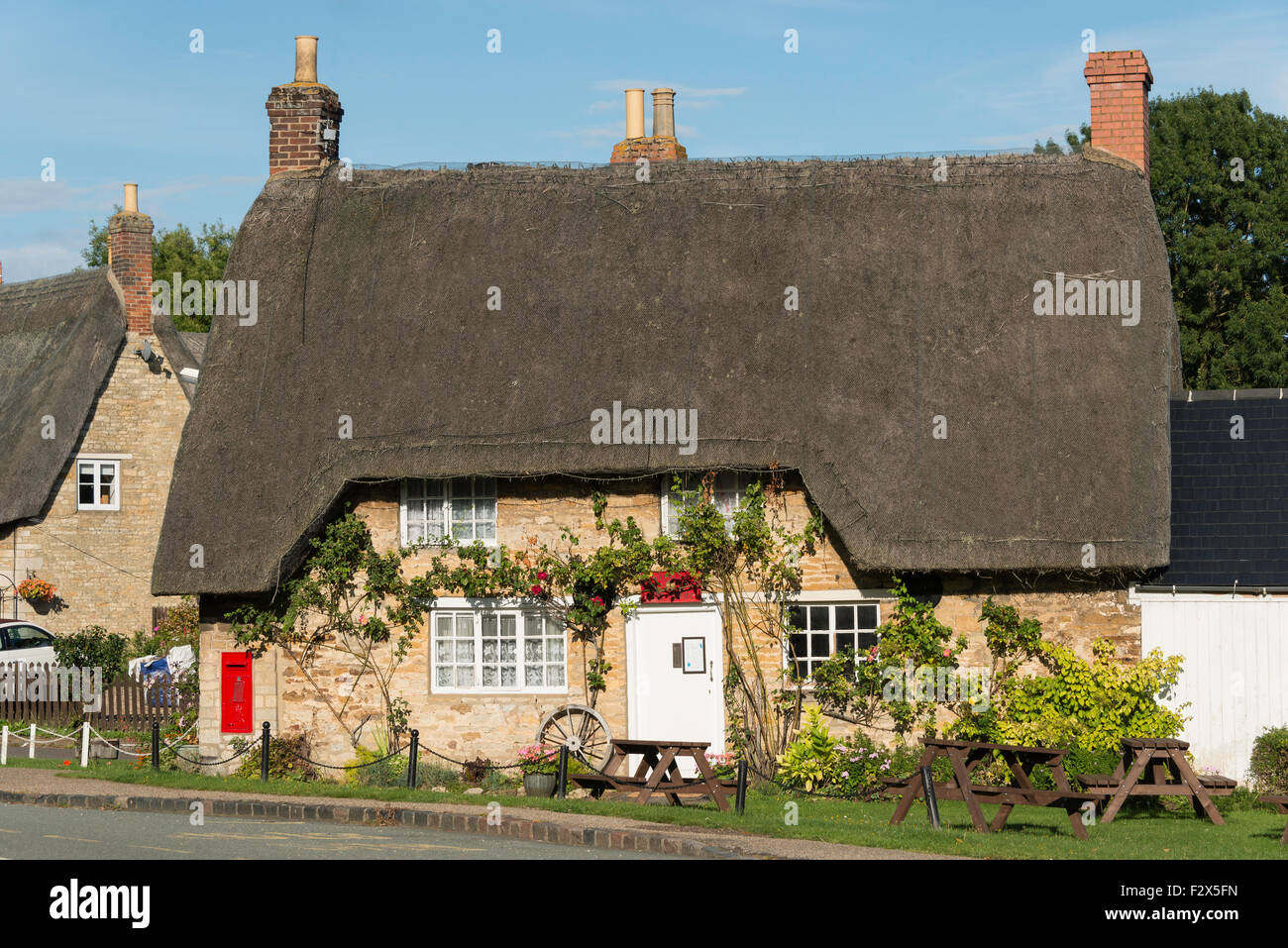 Thatched cottage (Old Post Office) in village of Weekley ...