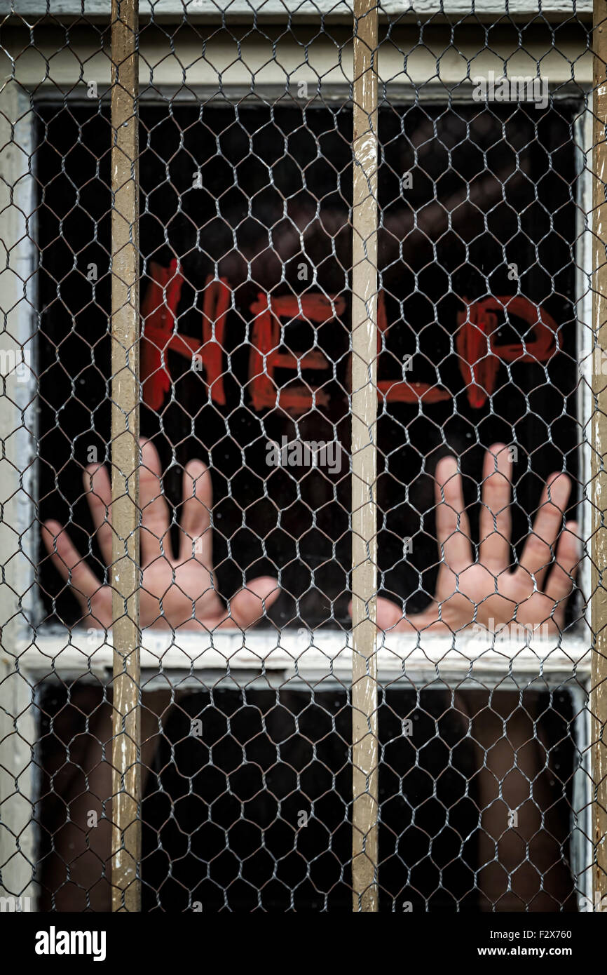 Woman's hand behind metal-grilled window begging for help Stock Photo ...