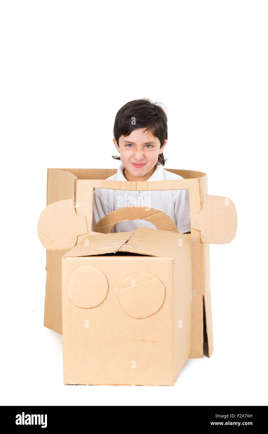 Adorable young boy sitting in a cardboard car playing isolated over ...