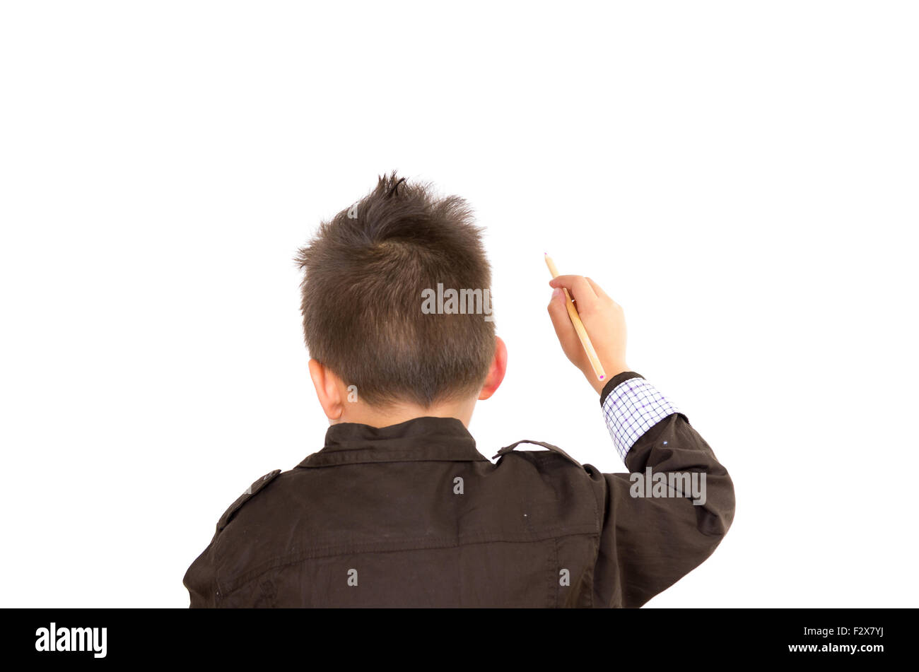 Little boy facing backwards, drawing in the air, isolated over white ...