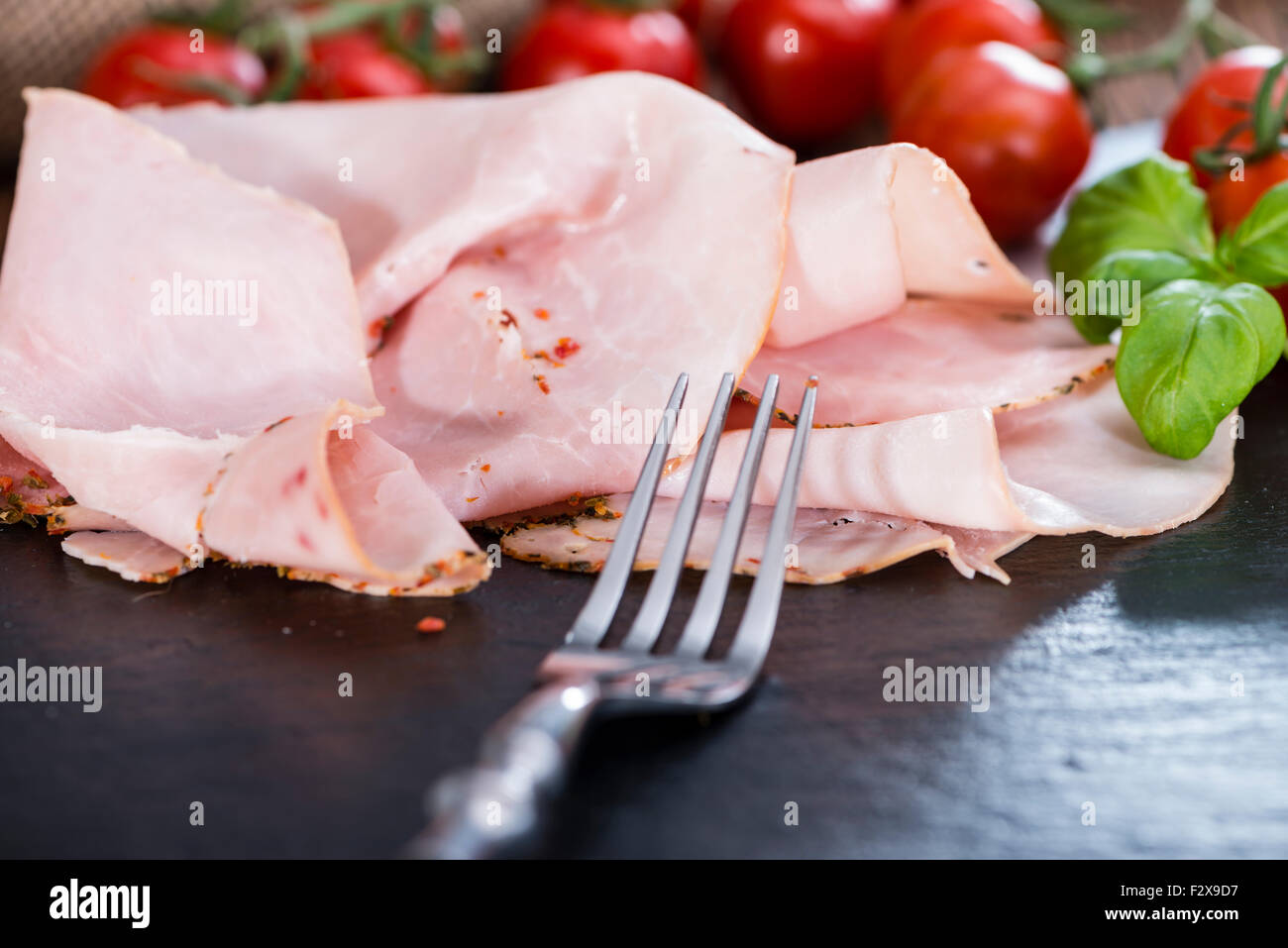 Slices of boiled ham (close-up shot) with fresh herbs Stock Photo - Alamy