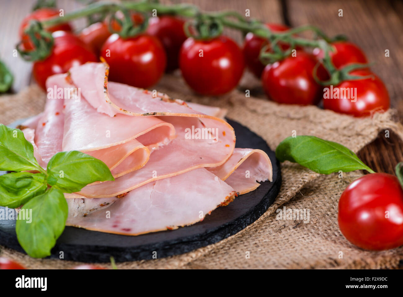 Slices of boiled ham (close-up shot) with fresh herbs Stock Photo - Alamy