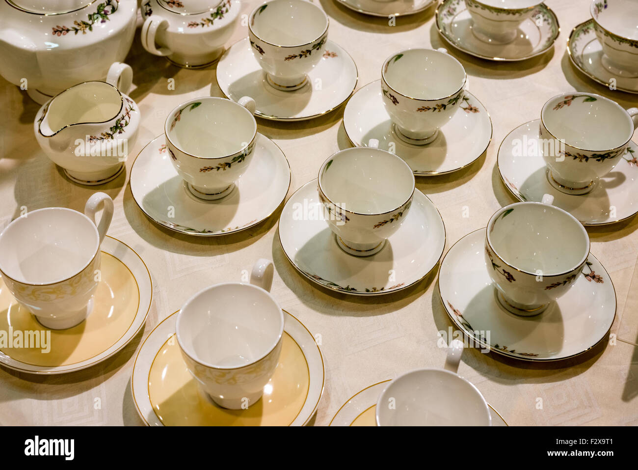 Many tea cups and saucers are on table Stock Photo - Alamy