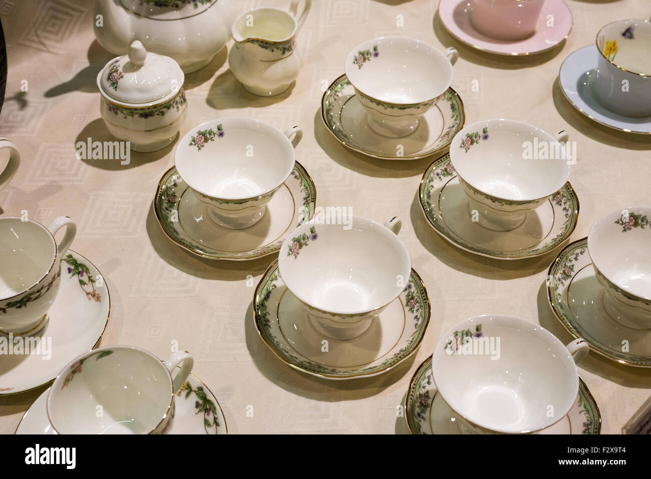 Many tea cups and saucers are on table Stock Photo - Alamy